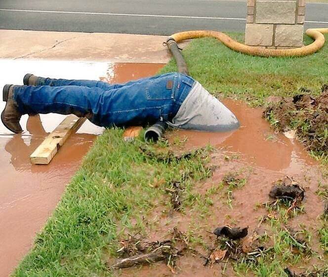 This Photo Of A Dedicated Plumber Submerged In Muddy Water Went Viral ...