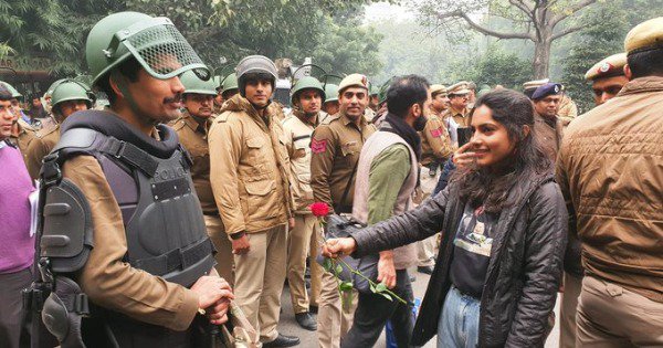 Picture Of A Protester Offering A Flower To The Police As A Gesture of ...